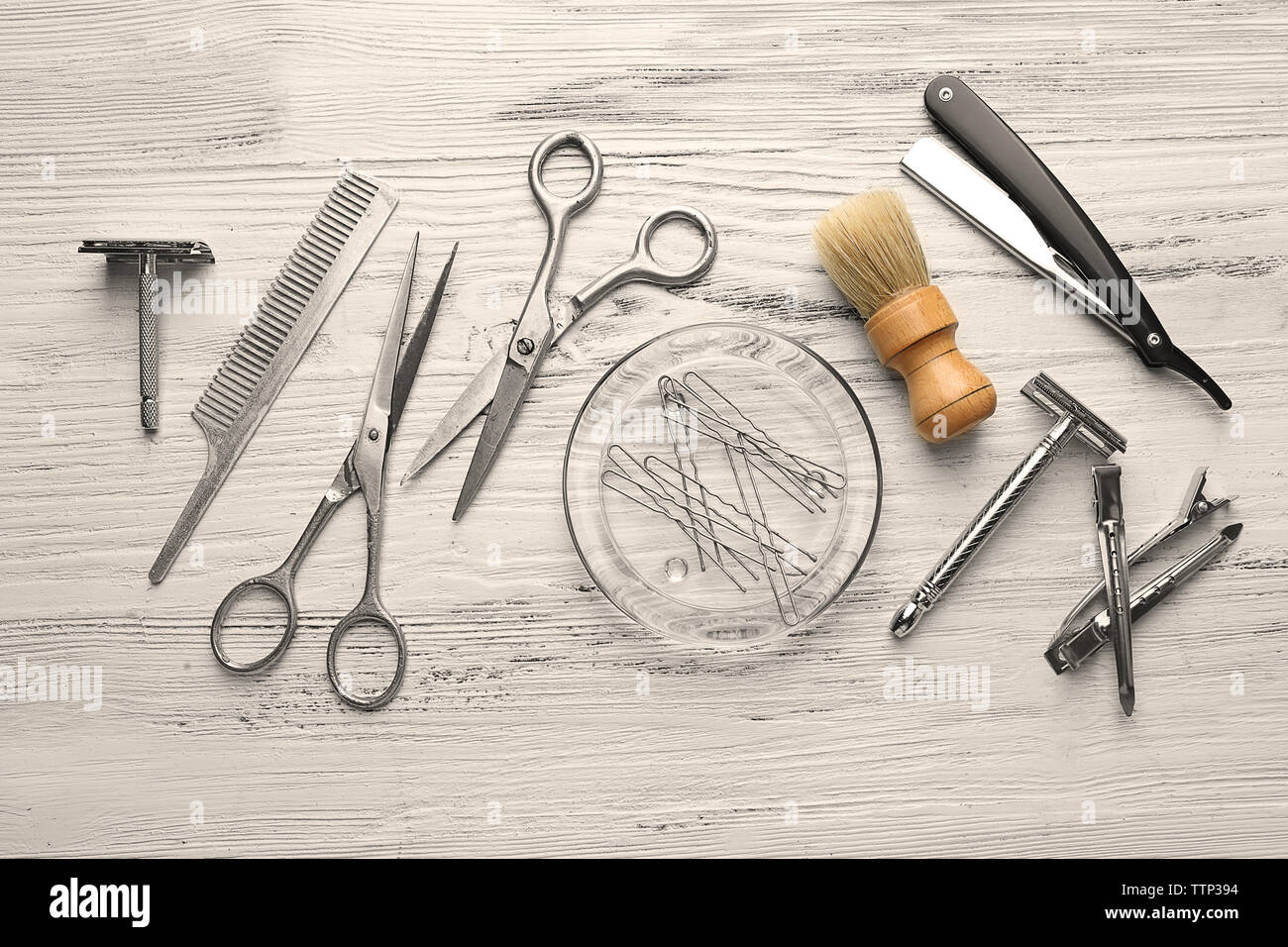 Vintage tools of barber shop on light wooden background Stock Photo - Alamy