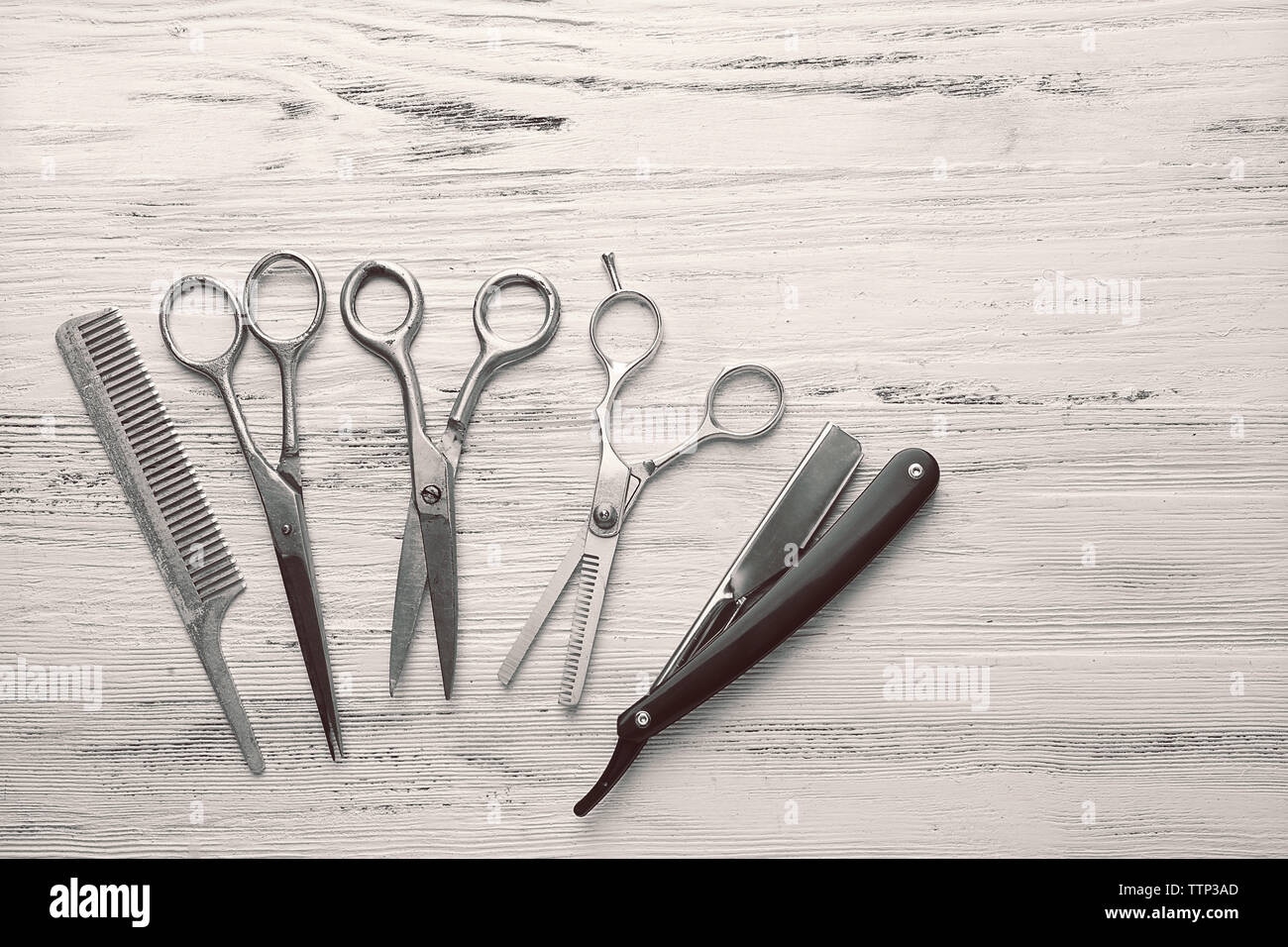 Vintage tools of barber shop on light wooden background Stock Photo - Alamy