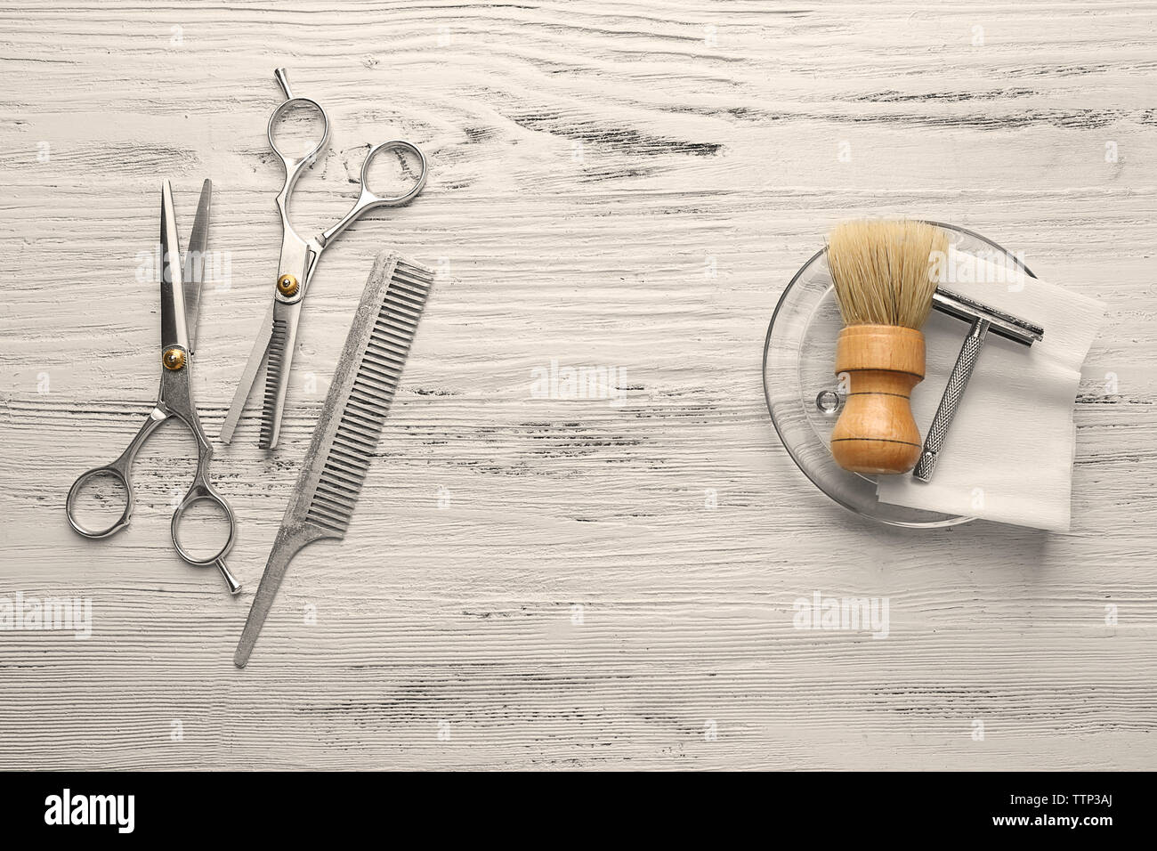 Vintage tools of barber shop on light wooden background Stock Photo - Alamy