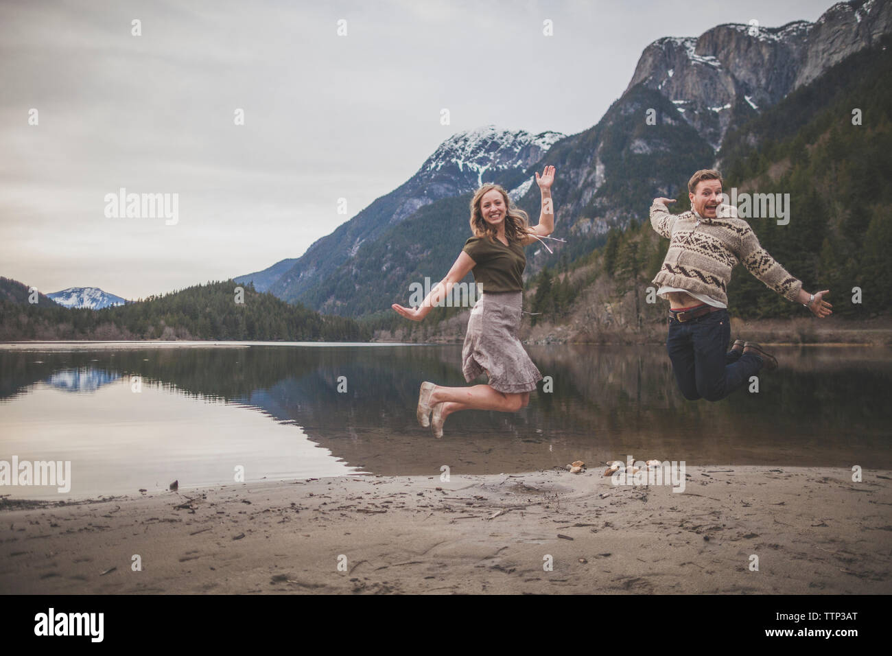 Couple jumping lake hi-res stock photography and images - Alamy