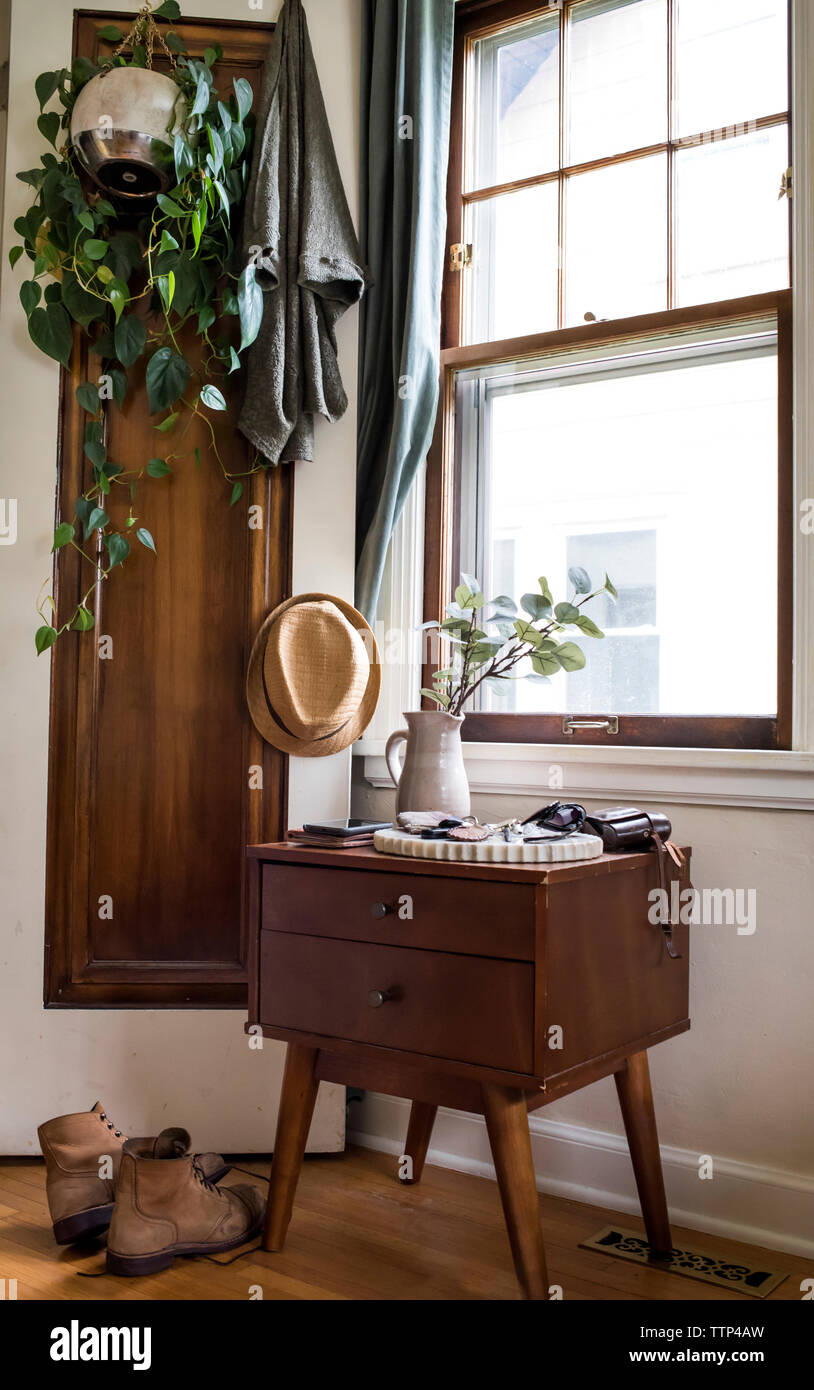 Wooden table by window at home Stock Photo - Alamy