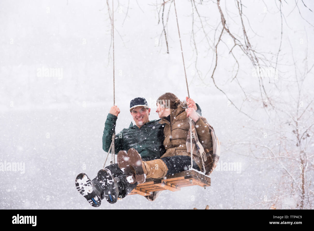 Romantic young couple on swing hi-res stock photography and images - Alamy