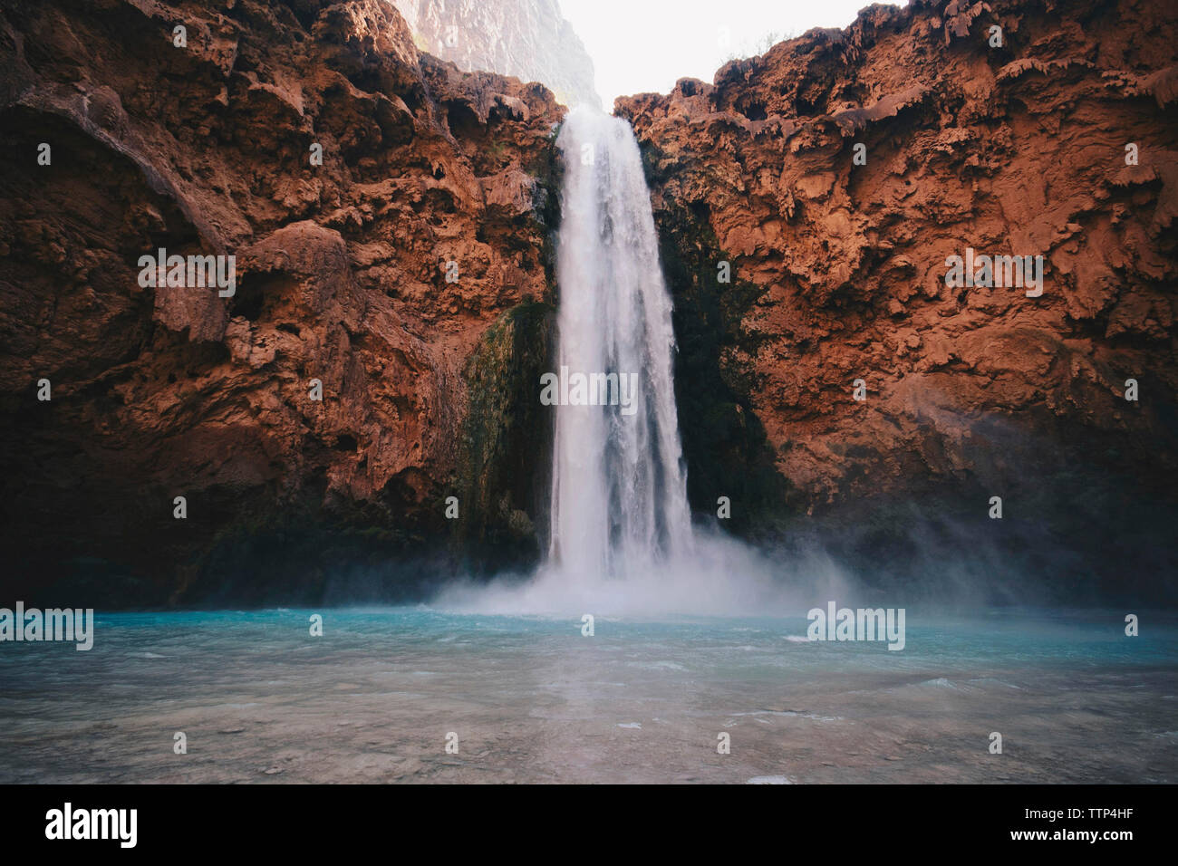 Scenic view of waterfall over rock formations Stock Photo - Alamy