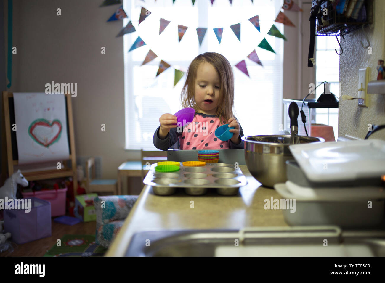 Girl making cupcakes in kitchen Stock Photo - Alamy