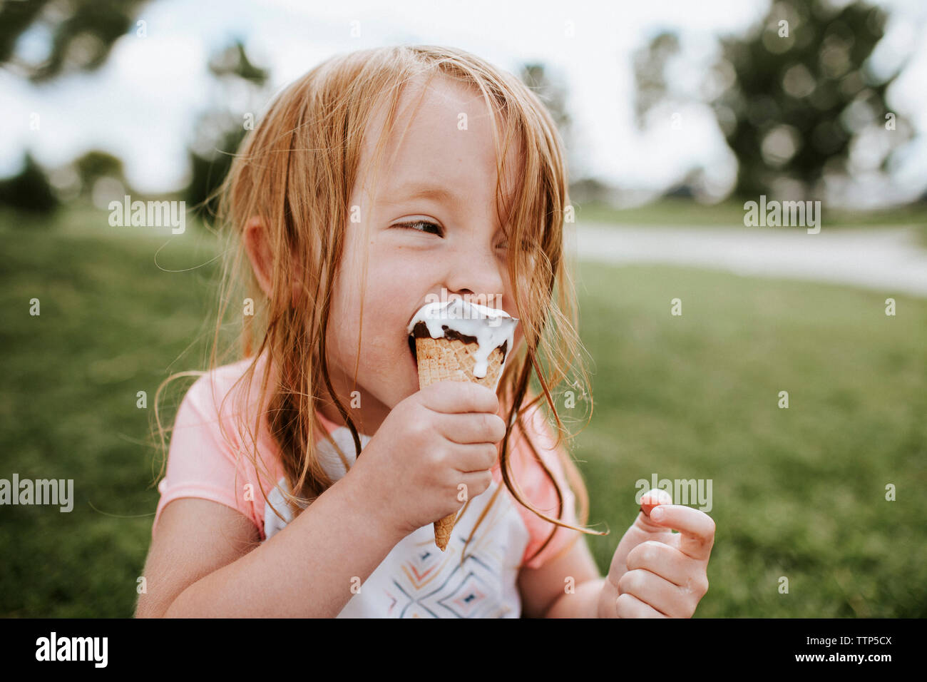 Girl eating ice cream hi-res stock photography and images - Alamy