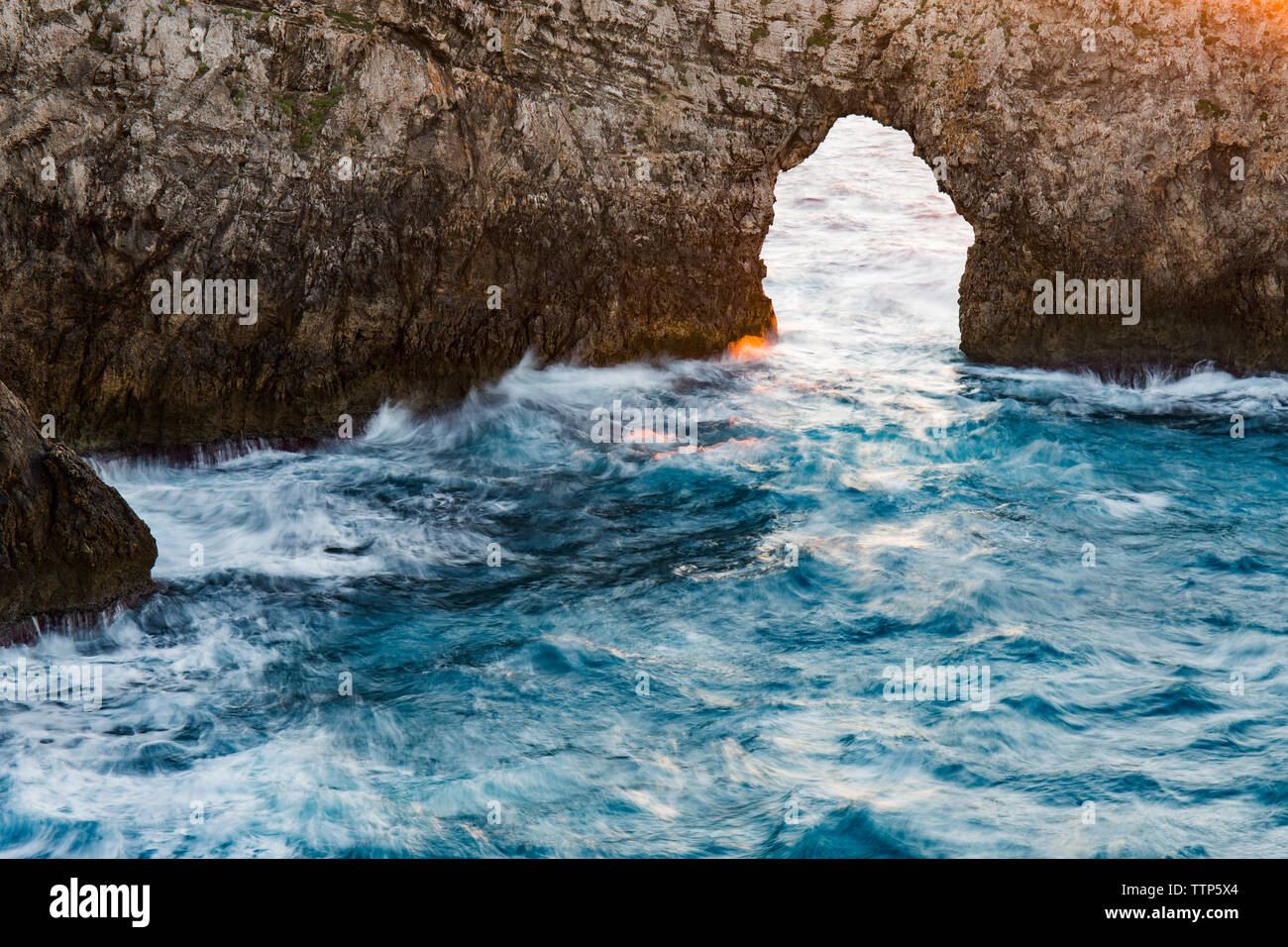 Natural arch over sea Stock Photo - Alamy