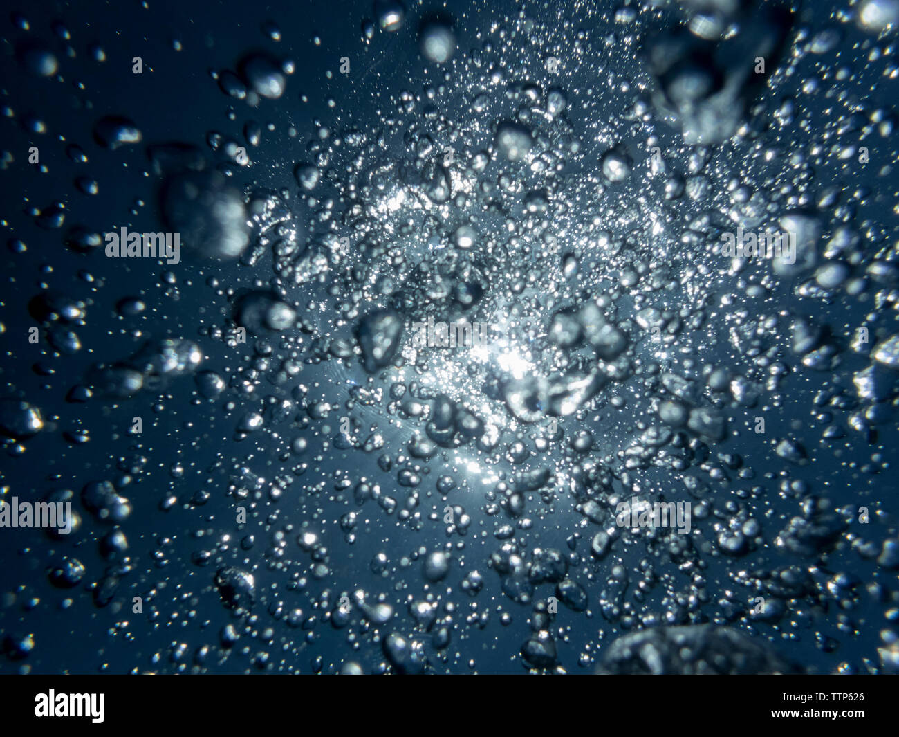 Overhead view of bubbles on sea surface Stock Photo - Alamy