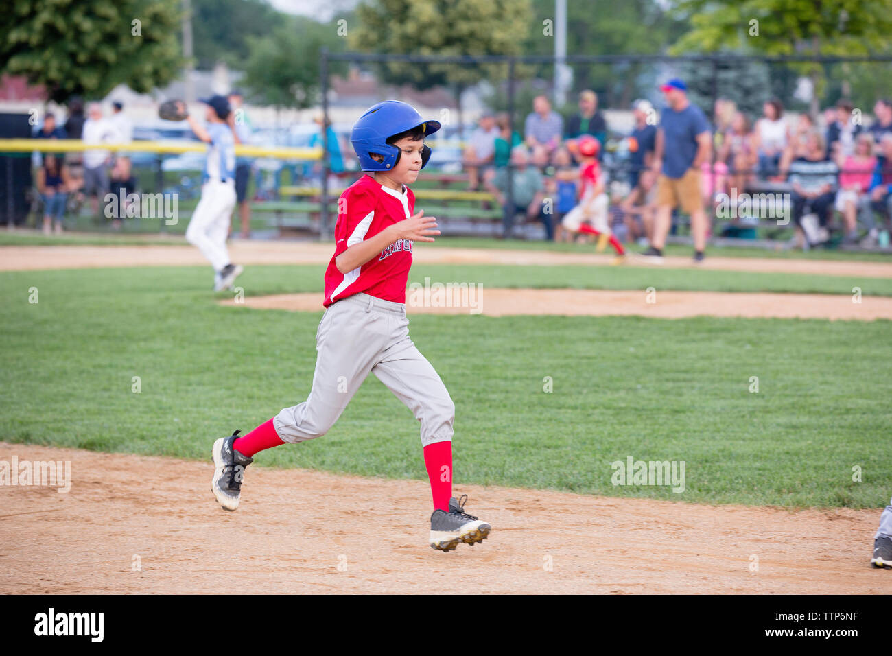 Full length of boy running on ground while playing baseball Stock Photo ...