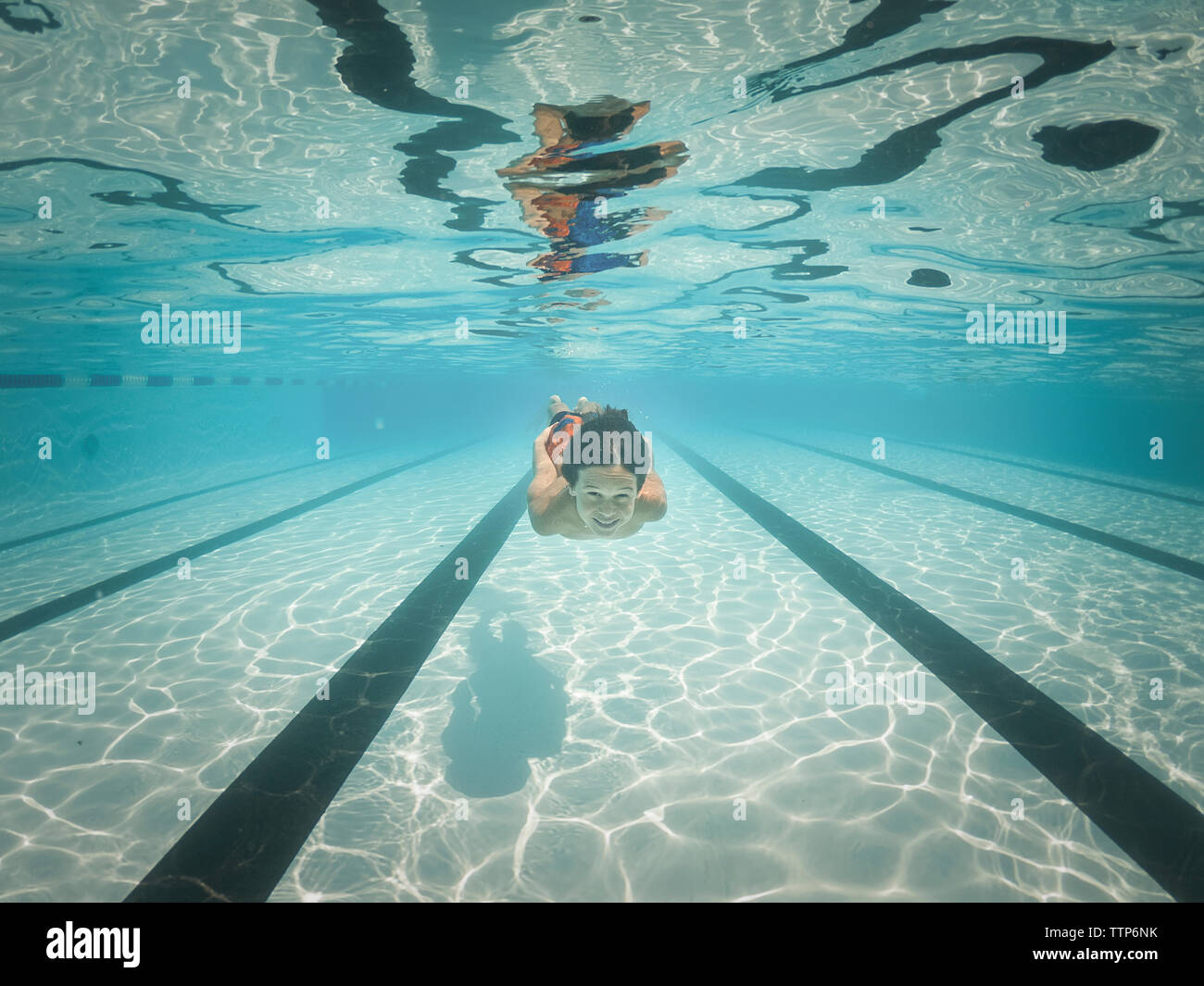 Portrait of boy swimming in pool Stock Photo - Alamy