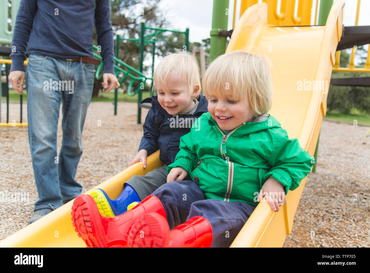 Playground slide man standing hi-res stock photography and images - Alamy