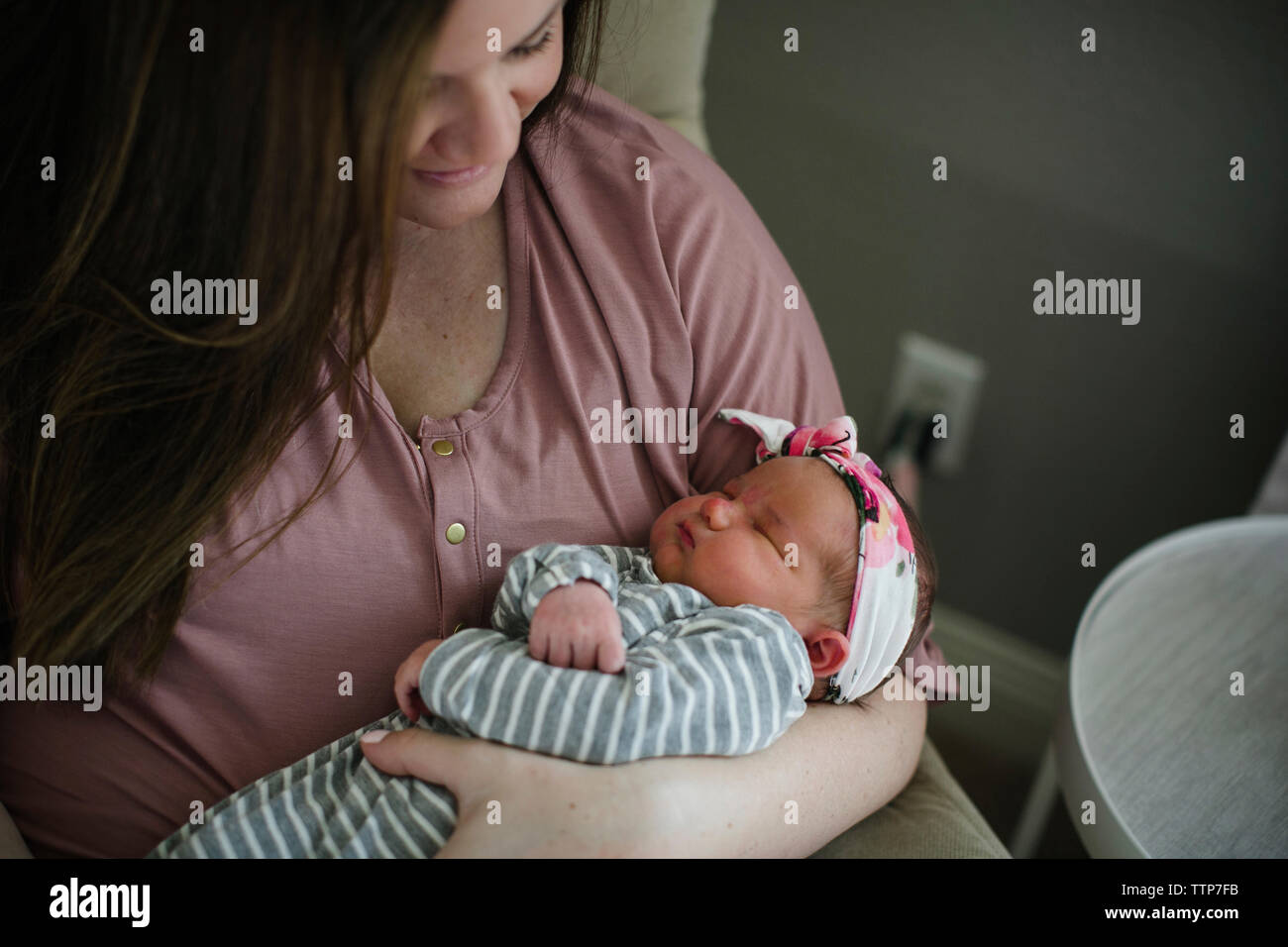 Mother carrying sleeping daughter hi-res stock photography and images ...