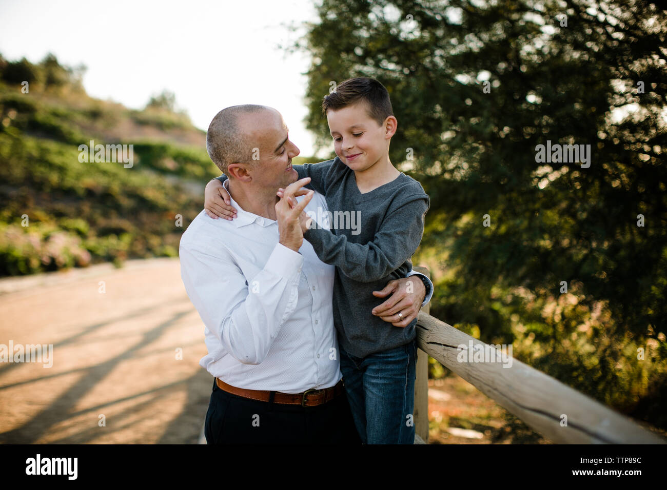 Father and Son Embrace and Smiling in Southern California Stock Photo ...