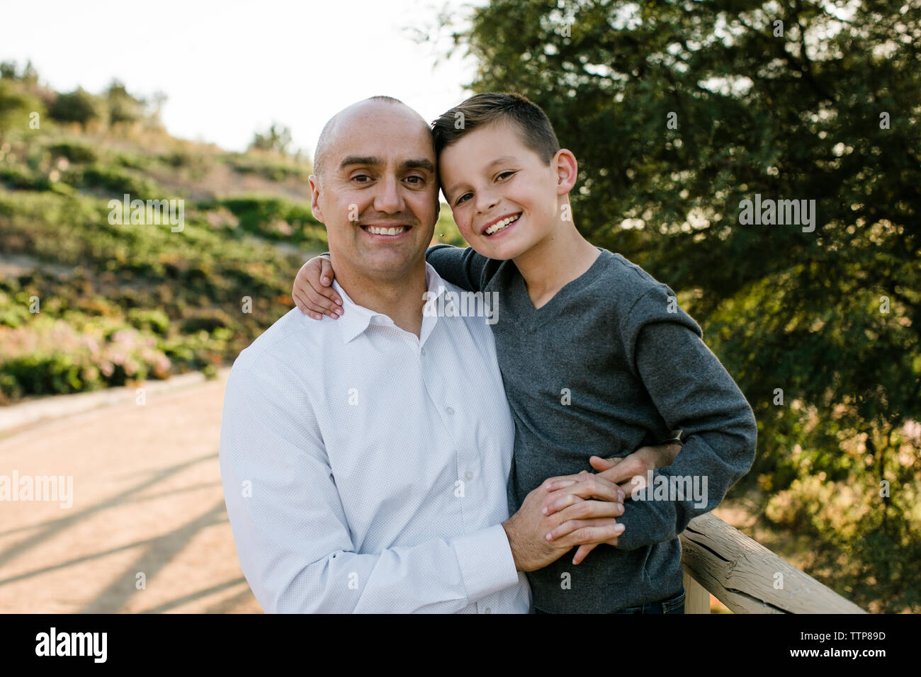 Dad hugging his kids hi-res stock photography and images - Alamy