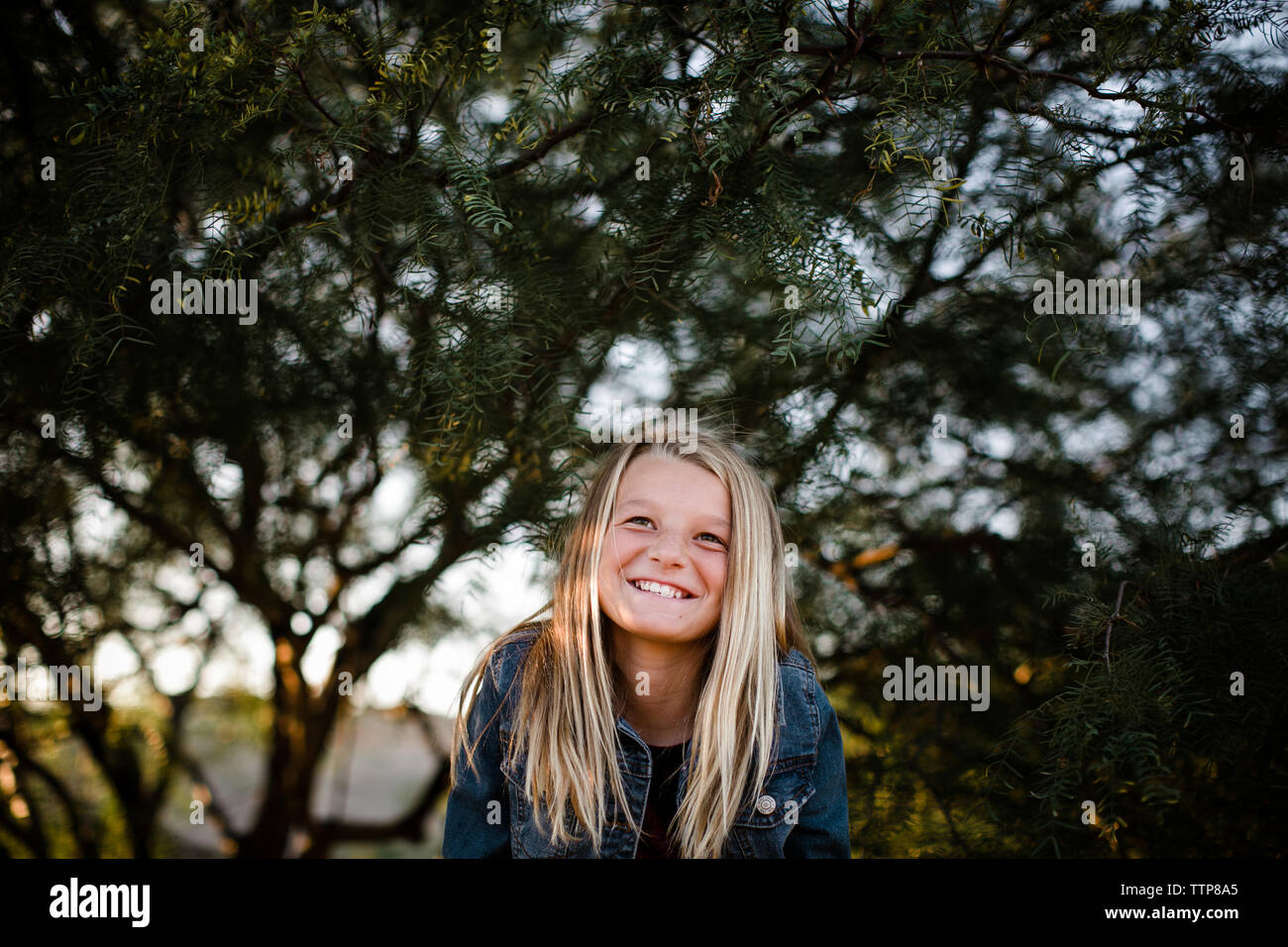 Young Girl Looking Up and Smiling in Southern California Stock Photo ...
