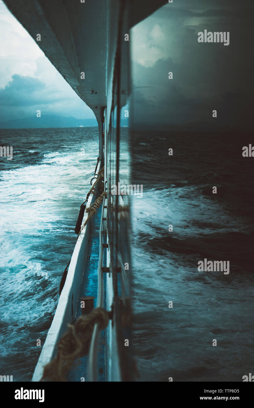 Close-up of sea waves reflecting in boat window Stock Photo - Alamy