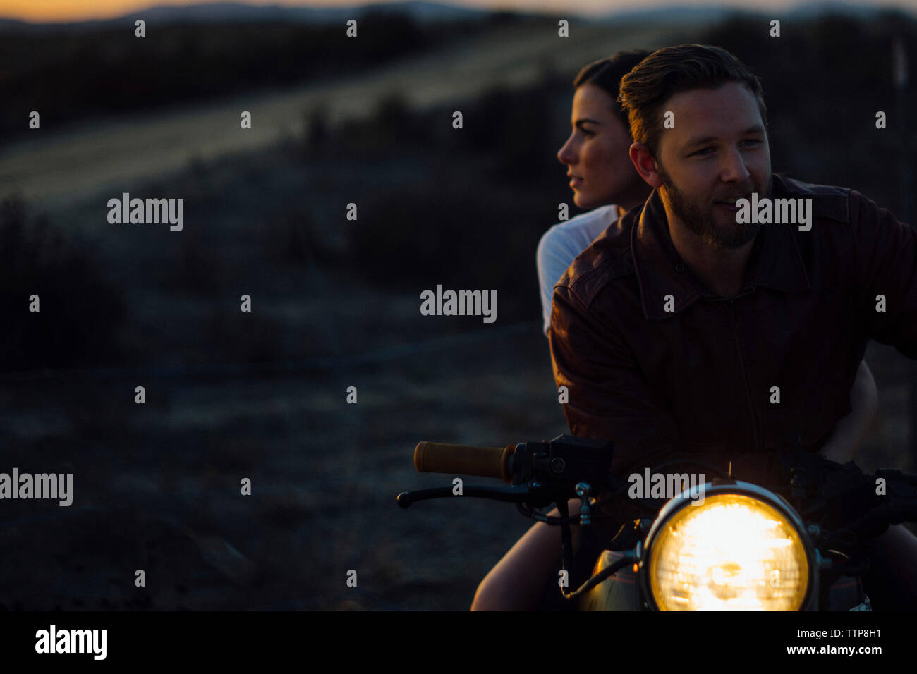 Young couple riding motorcycle together hi-res stock photography and ...