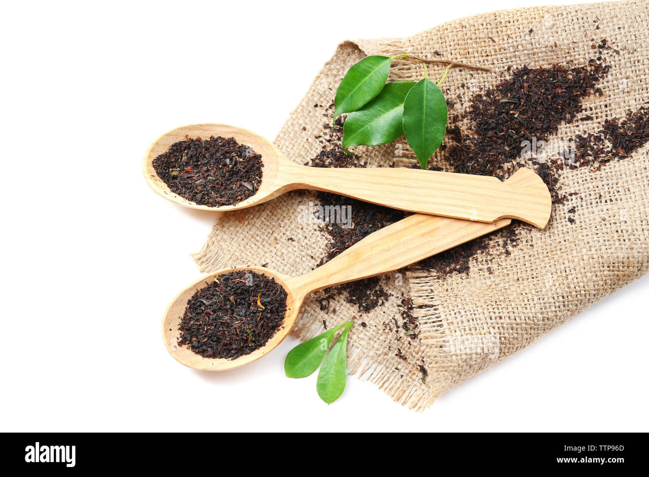 Black tea in wooden spoons isolated on white Stock Photo - Alamy