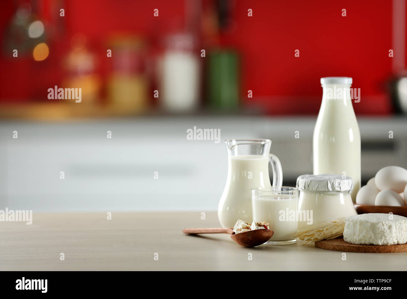 Dairy products on kitchen table Stock Photo - Alamy