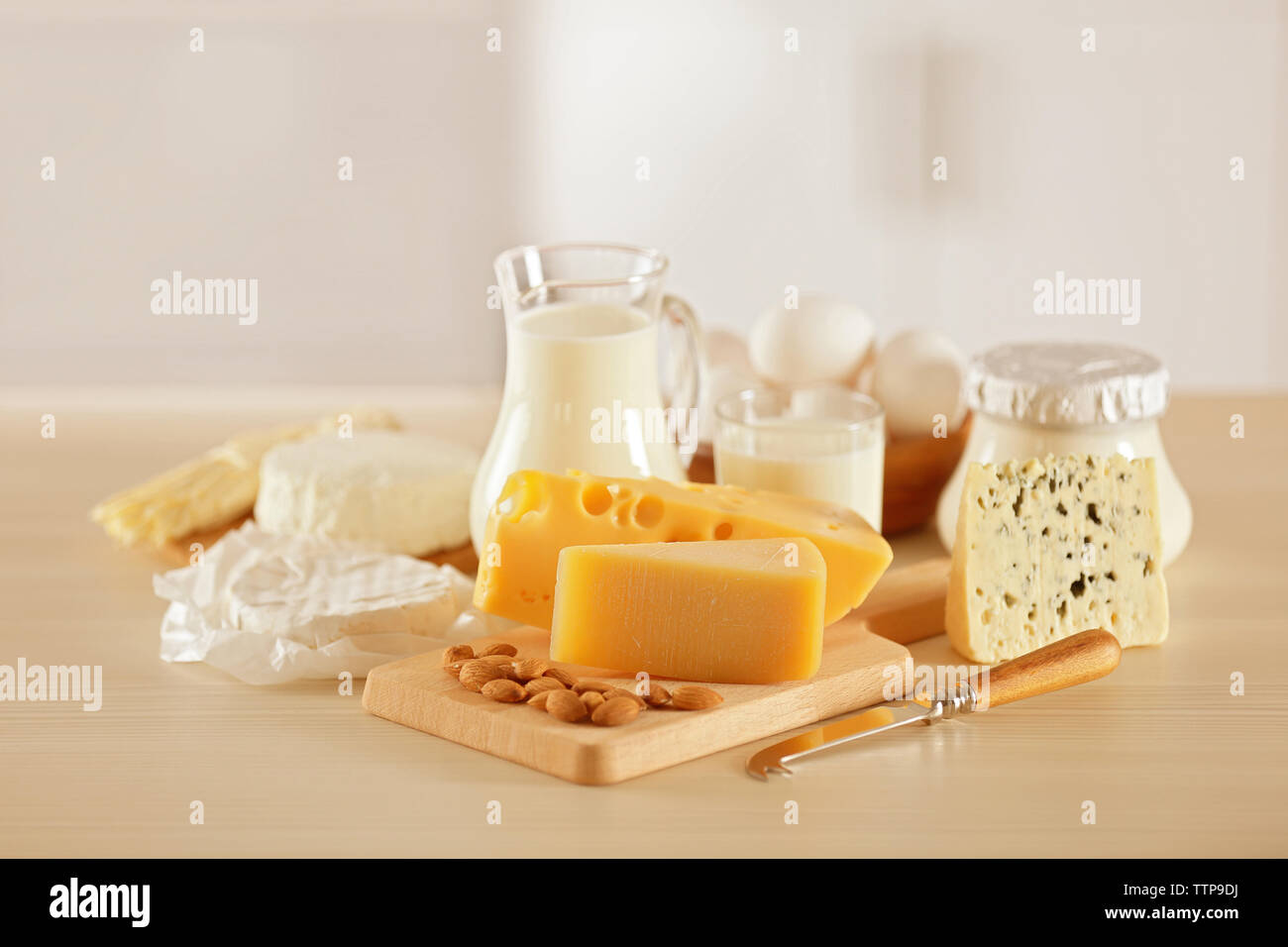 Dairy products on kitchen table Stock Photo - Alamy