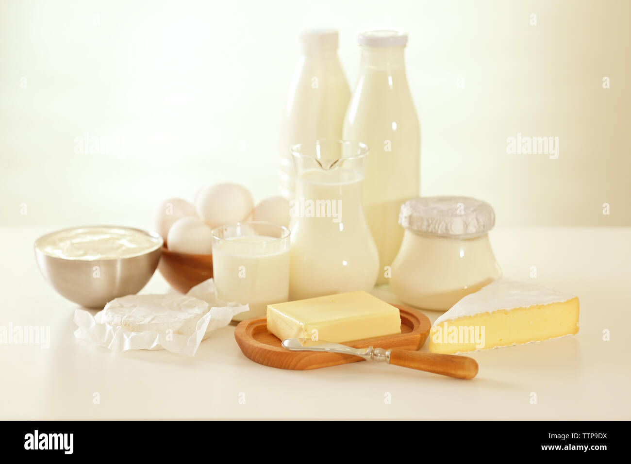 Dairy products on kitchen table Stock Photo - Alamy