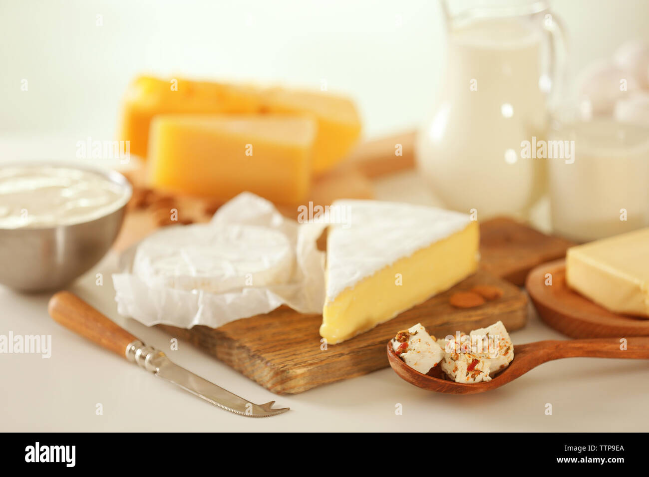 Dairy products on kitchen table Stock Photo - Alamy