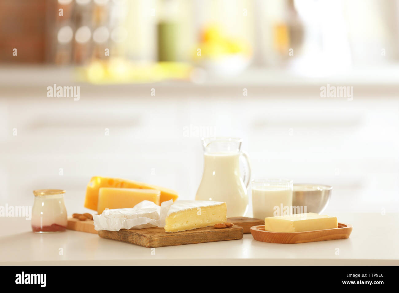 Dairy products on kitchen table Stock Photo - Alamy