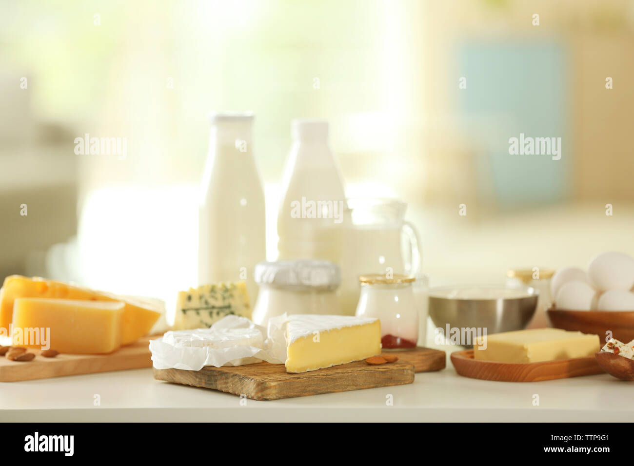 Dairy products on kitchen table Stock Photo - Alamy