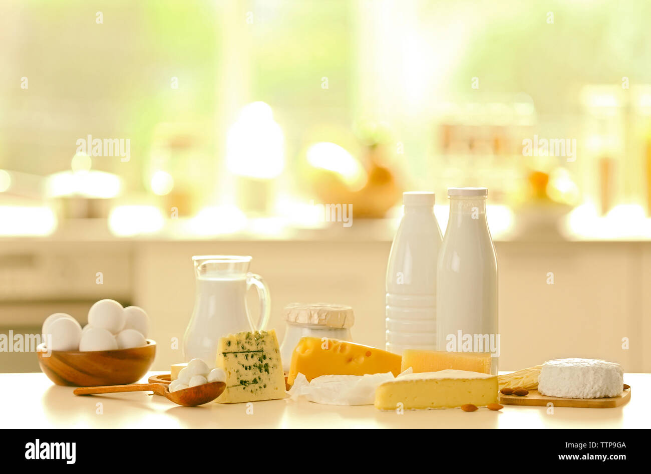 Dairy products on kitchen table Stock Photo - Alamy