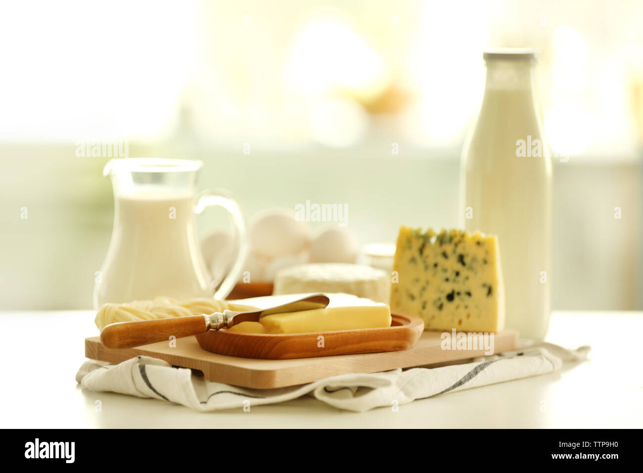Dairy products on kitchen table Stock Photo - Alamy