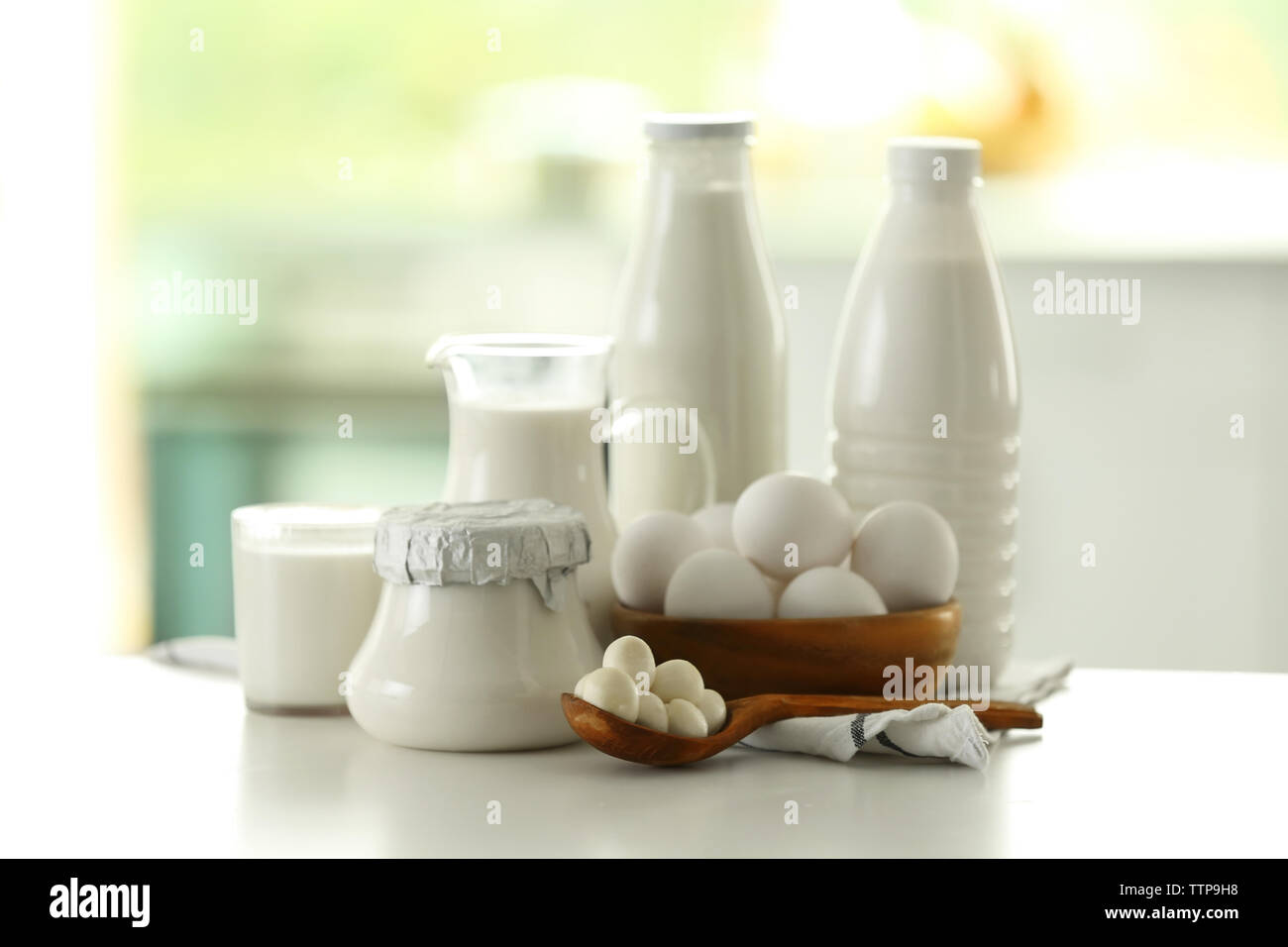 Dairy products on kitchen table Stock Photo - Alamy