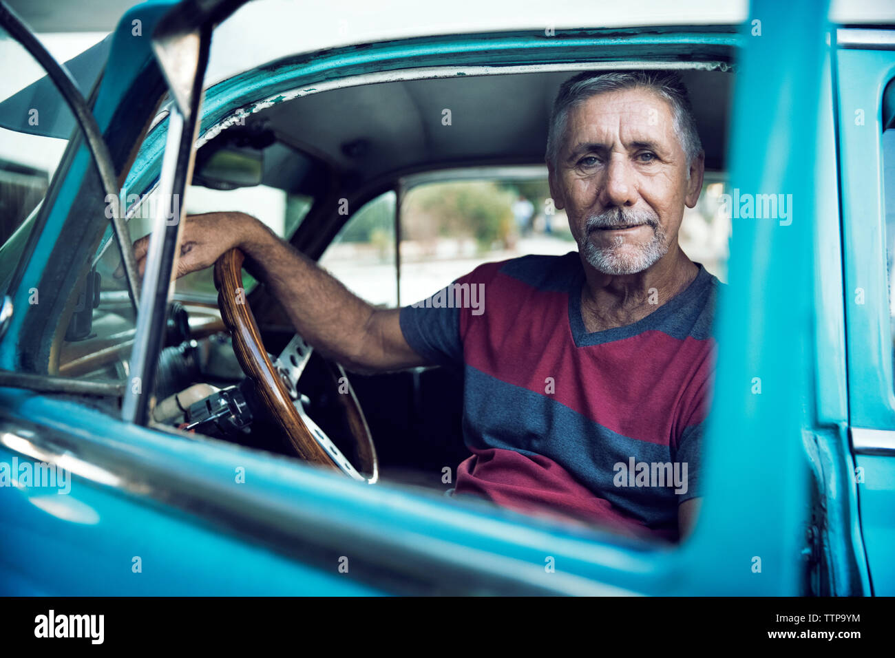Portrait of man sitting in car Stock Photo - Alamy