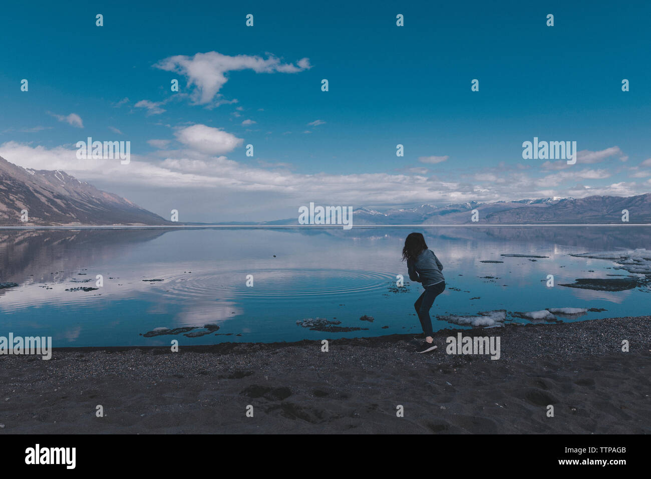 Throwing stones into water hi-res stock photography and images - Alamy