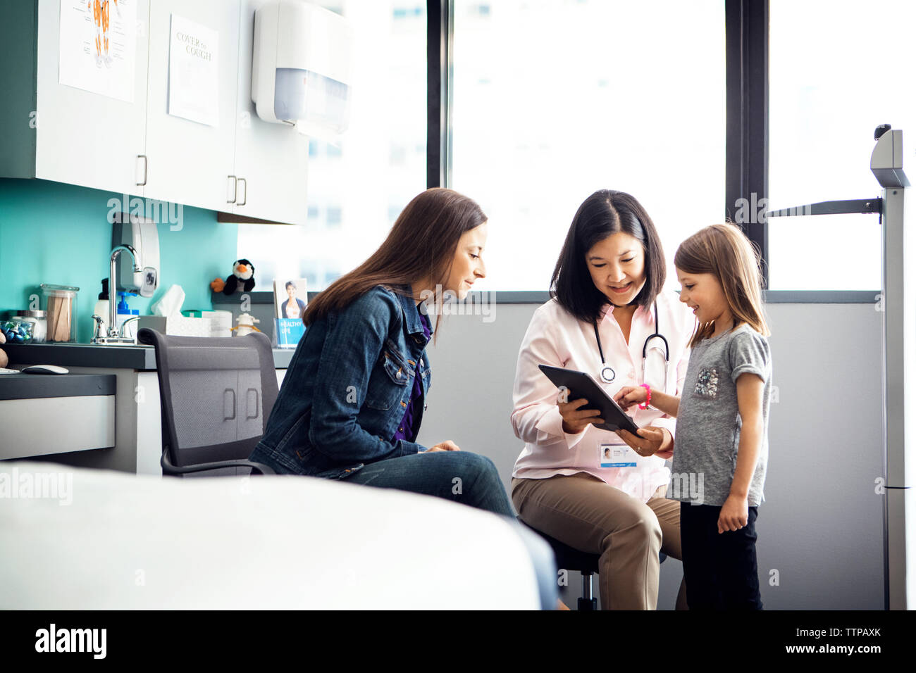 Mature female pediatrician using hi-res stock photography and images ...