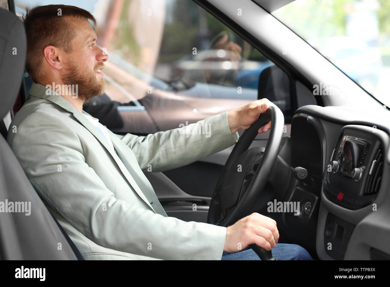 Man driving his car Stock Photo - Alamy