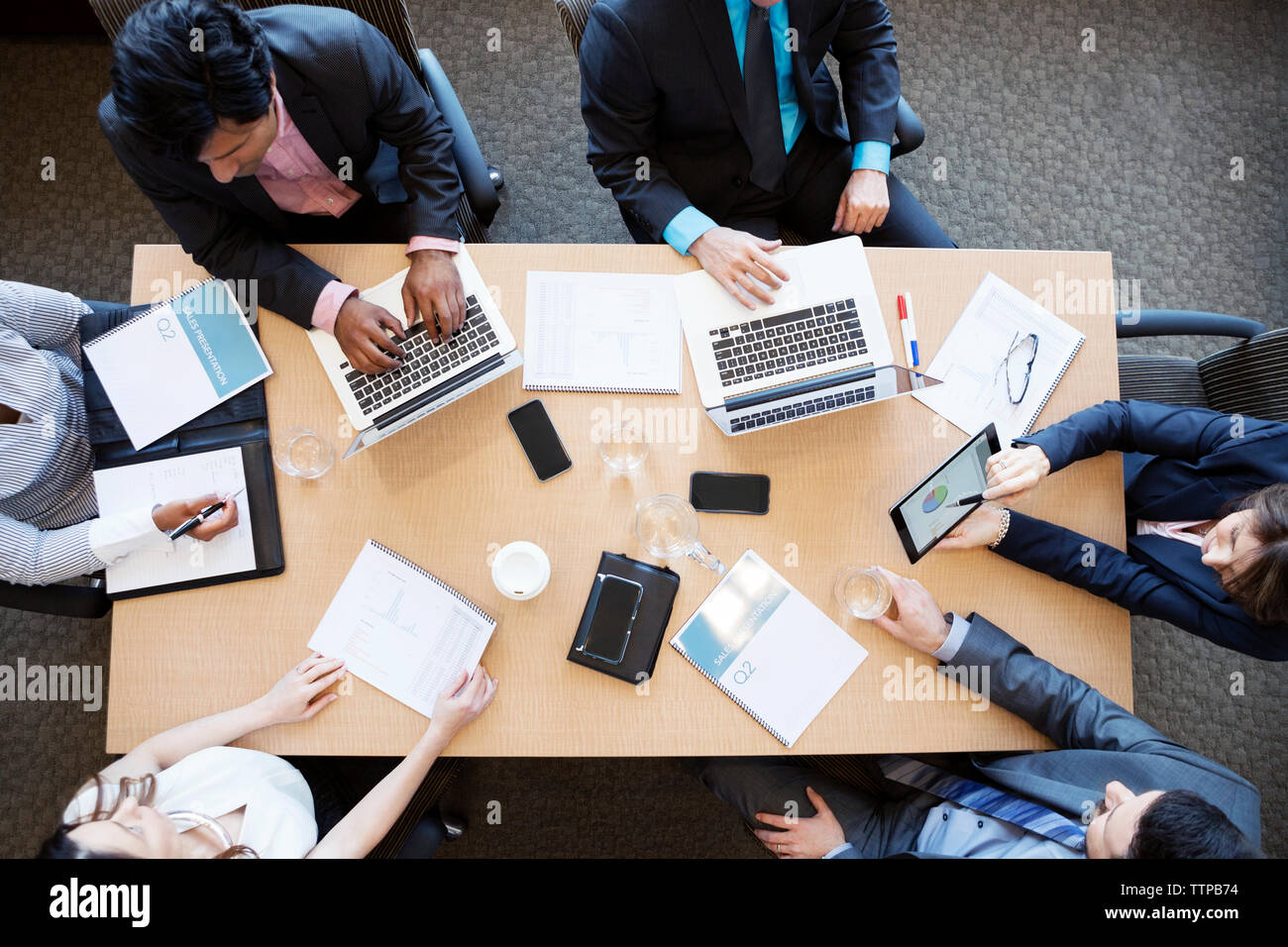 Overhead view of business people in meeting Stock Photo - Alamy