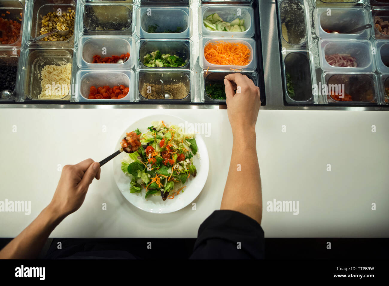 Overhead view of chef making food in commercial kitchen Stock Photo - Alamy