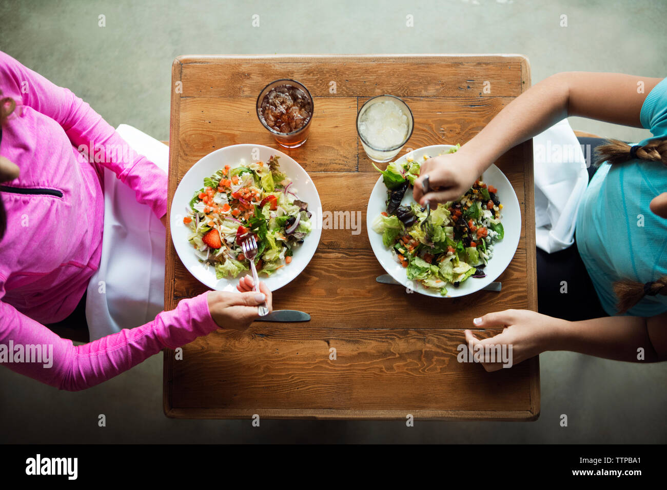 Overhead view of family having food in restaurant Stock Photo - Alamy