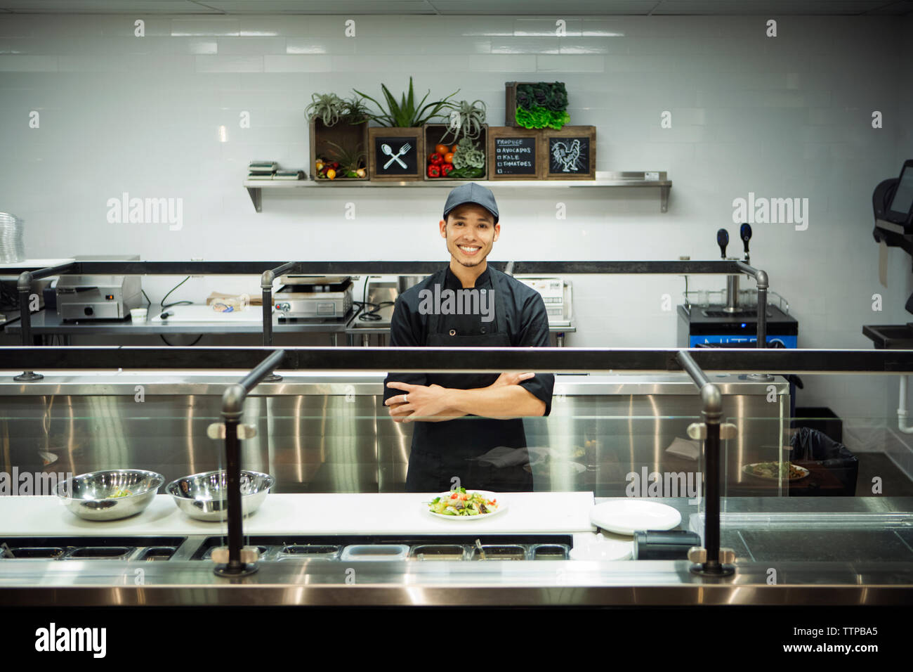 Male chef standing arms hi-res stock photography and images - Alamy