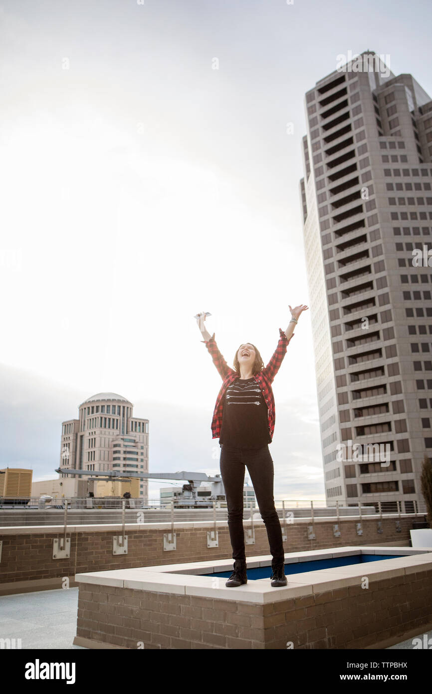 Woman standing raised arms High Resolution Stock Photography and Images ...