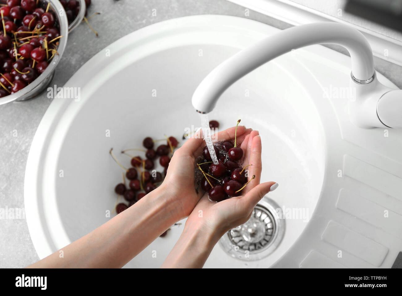 Closeup hands washing fresh fruits hi-res stock photography and images ...