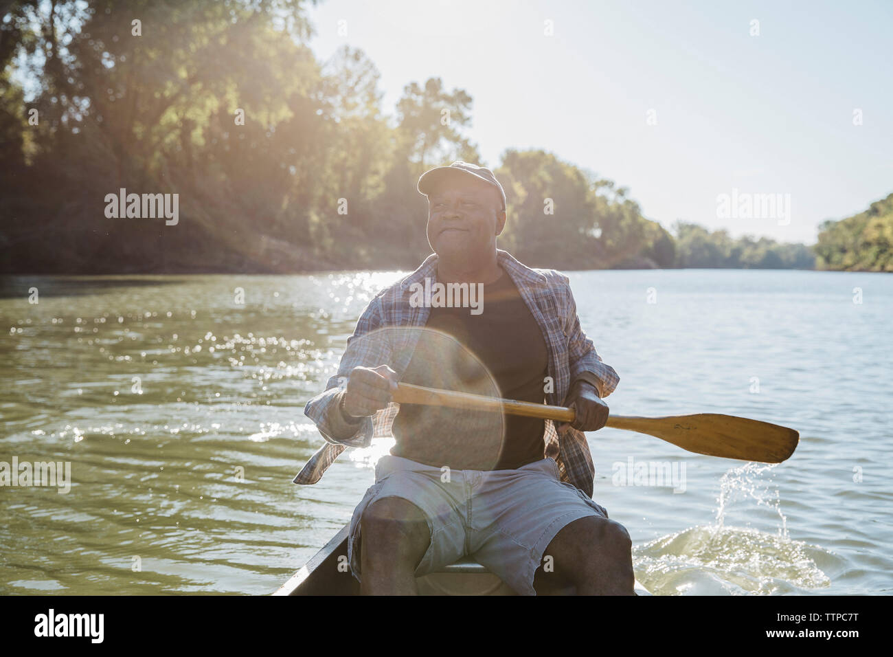 African man rowing boat hi-res stock photography and images - Alamy