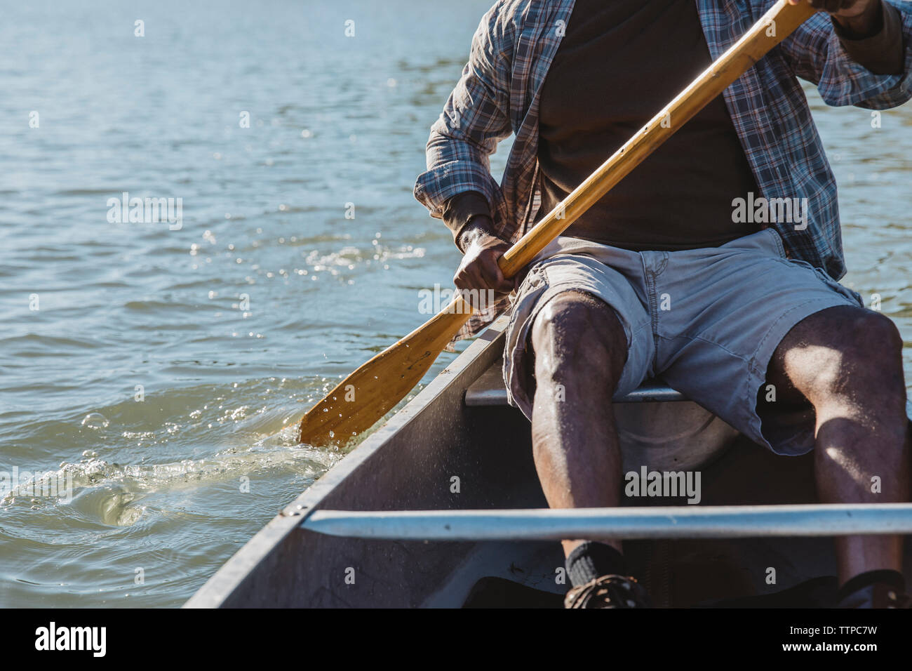African man rowing boat hi-res stock photography and images - Alamy