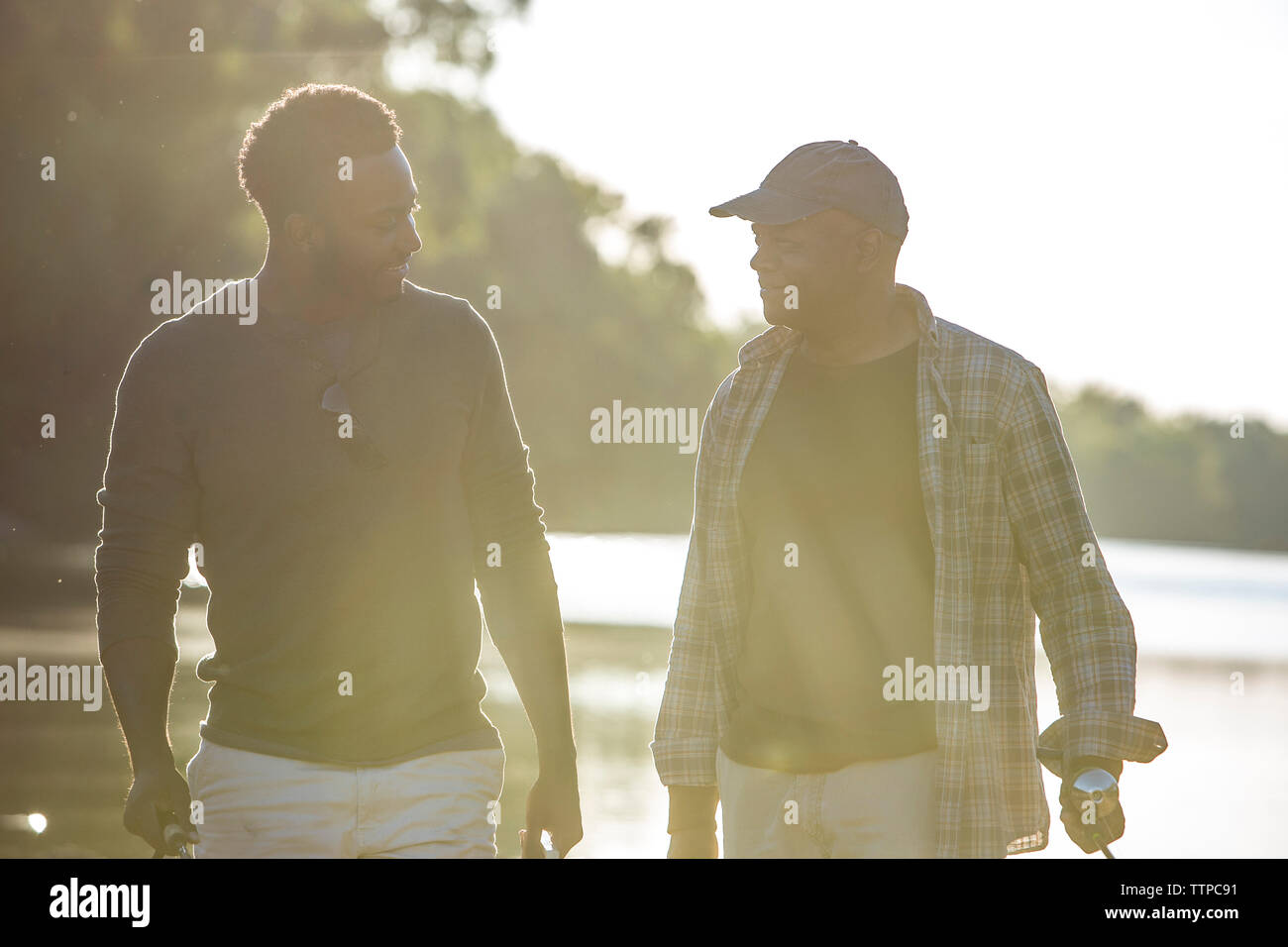 Two male friends talking outdoors hi-res stock photography and images ...