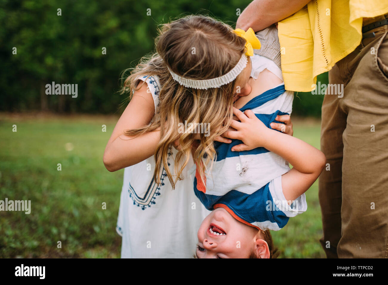 Happy family playing at backyard Stock Photo - Alamy