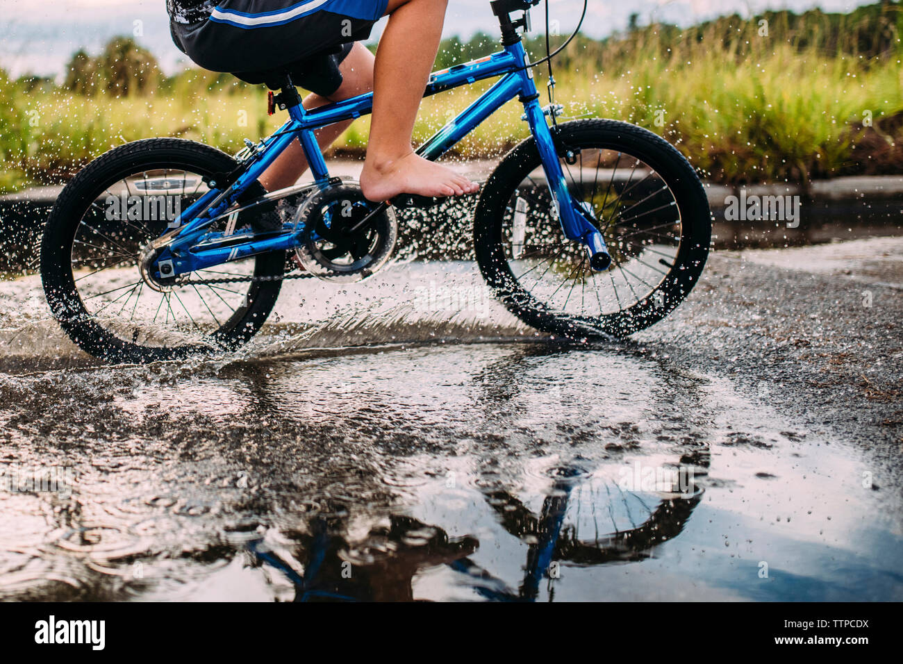 Boy bicycle side view hi-res stock photography and images - Alamy