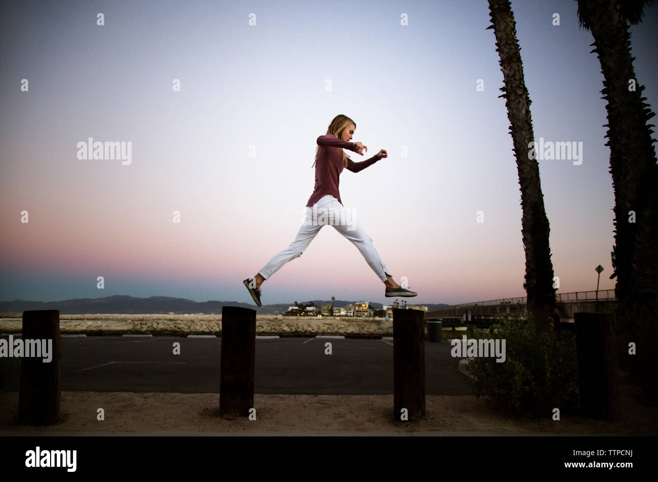 Woman jumping on street hi-res stock photography and images - Alamy