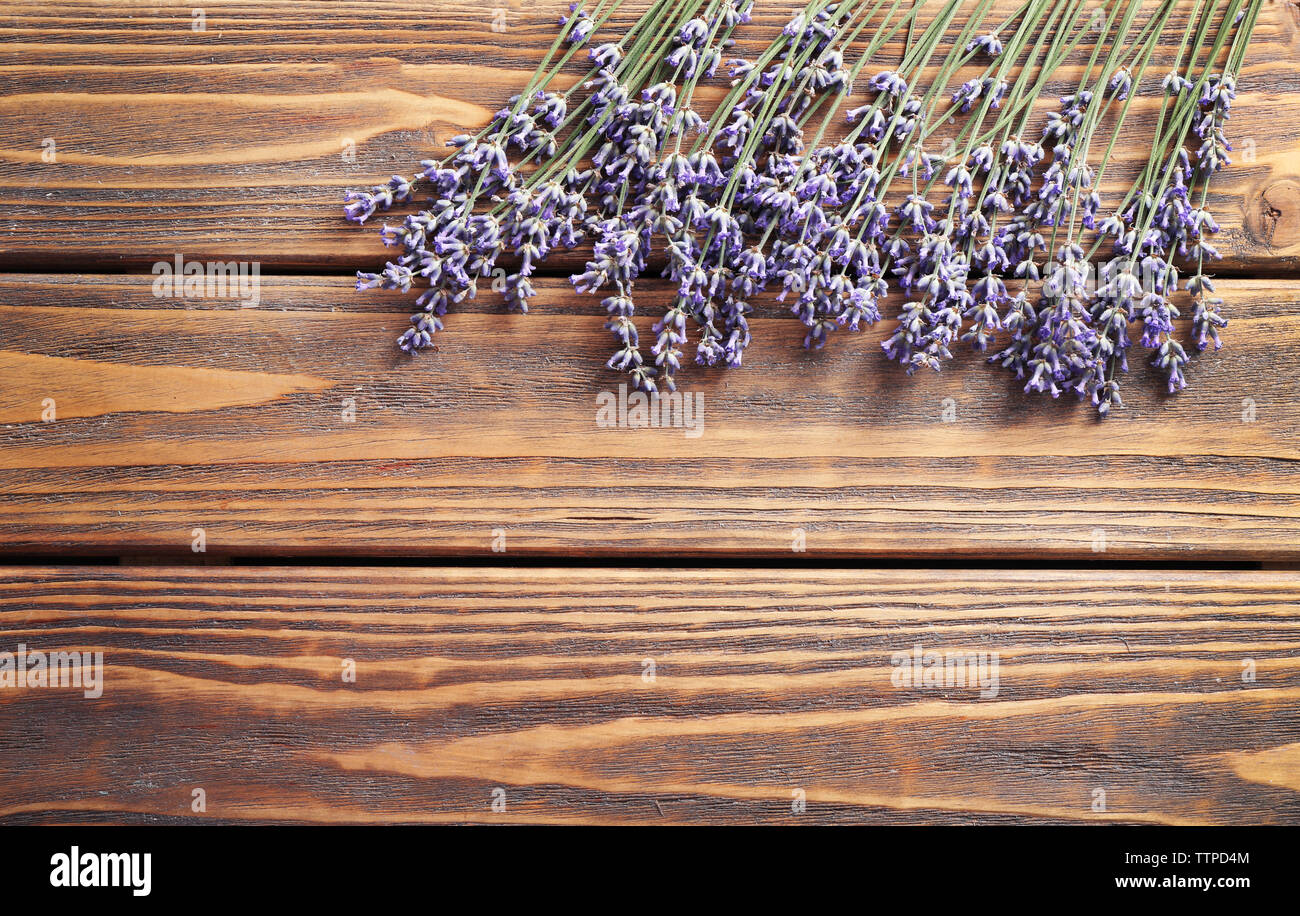 Bunch of lavender on wooden table Stock Photo - Alamy