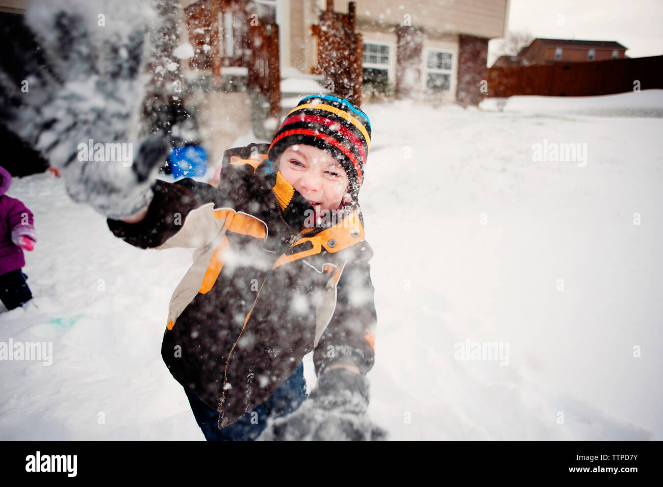 Boy playing in deep snow hi-res stock photography and images - Alamy
