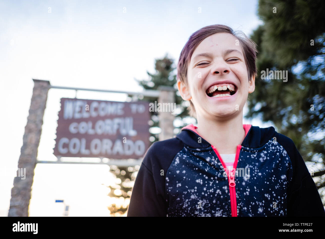 girl laughing at colorado border Stock Photo - Alamy