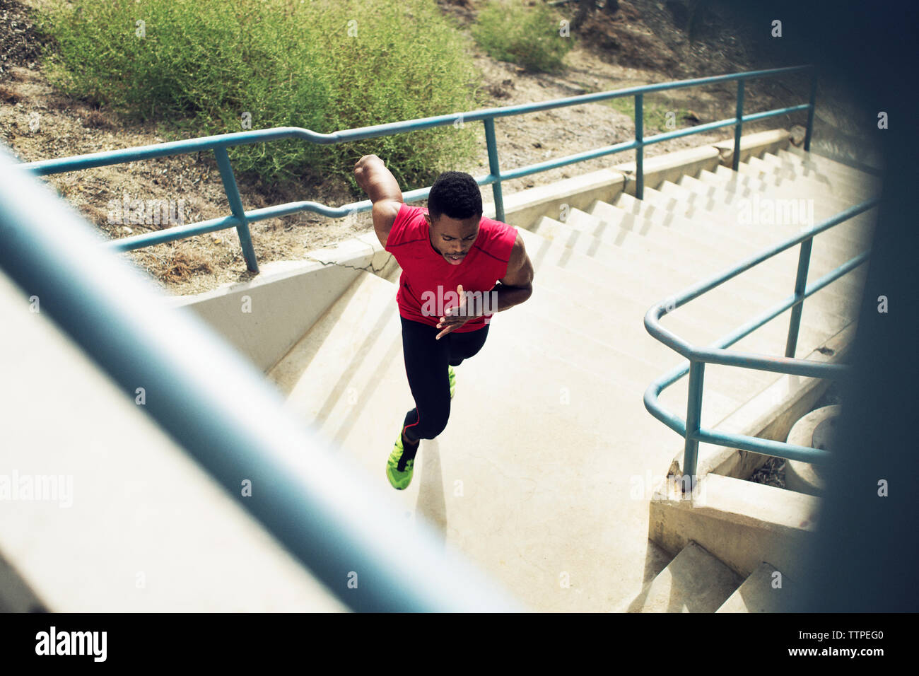 High angle view of sporty man running on steps Stock Photo - Alamy